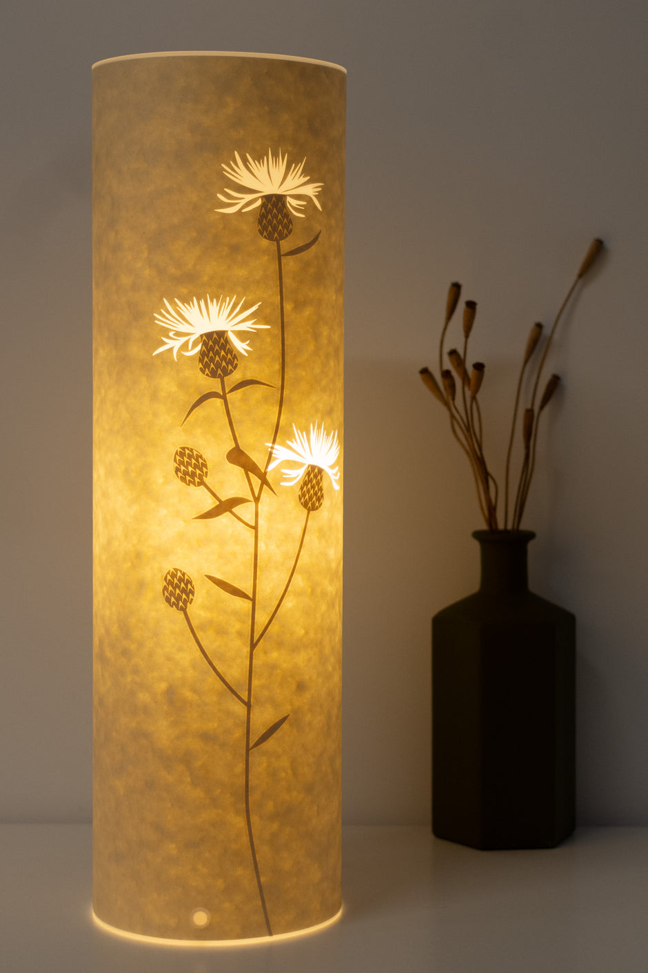 Glowing handmade parchment paper lamps with cut out nature designs by ...