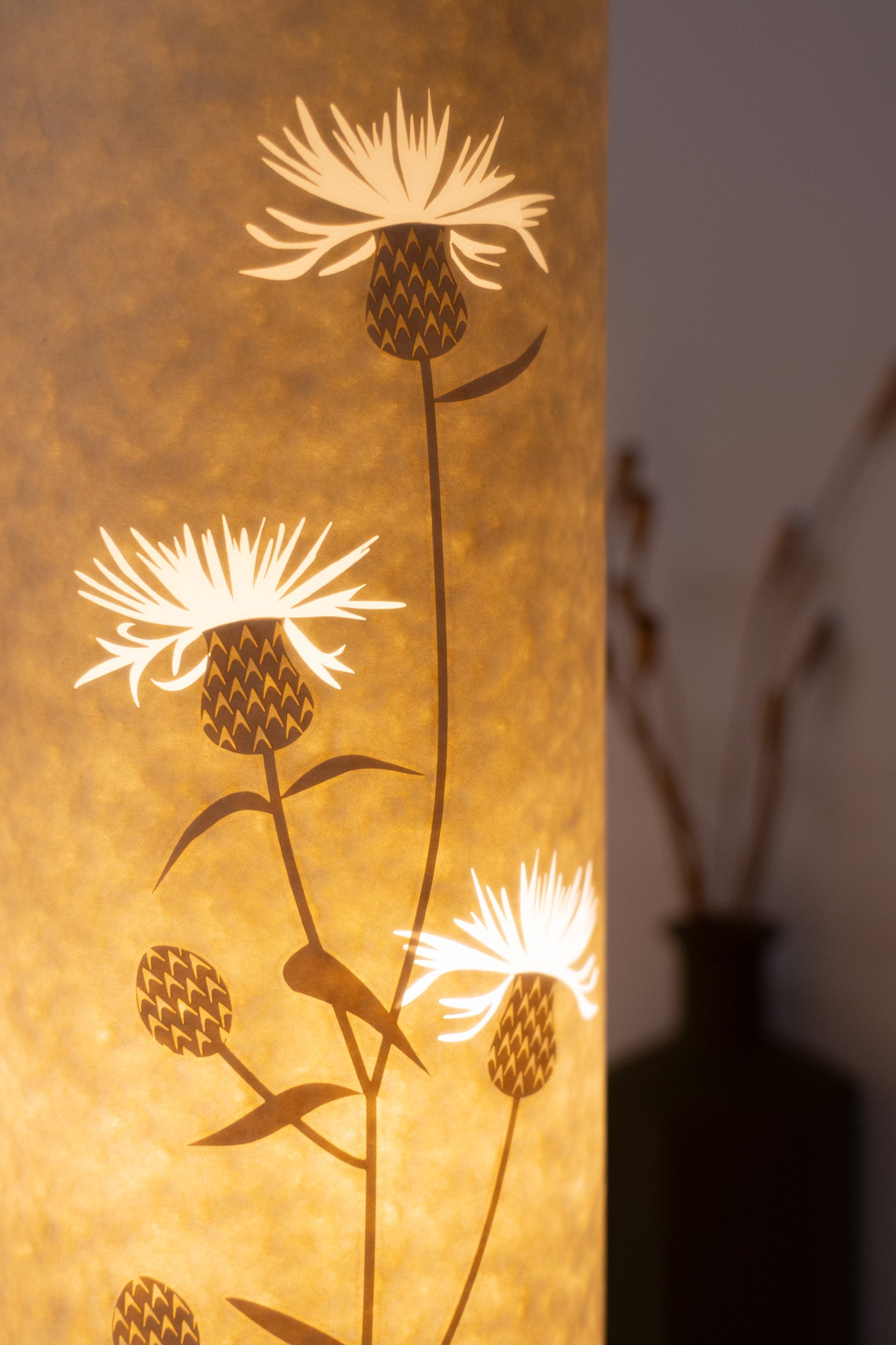 Glowing handmade parchment paper lamps with cut out nature designs by ...
