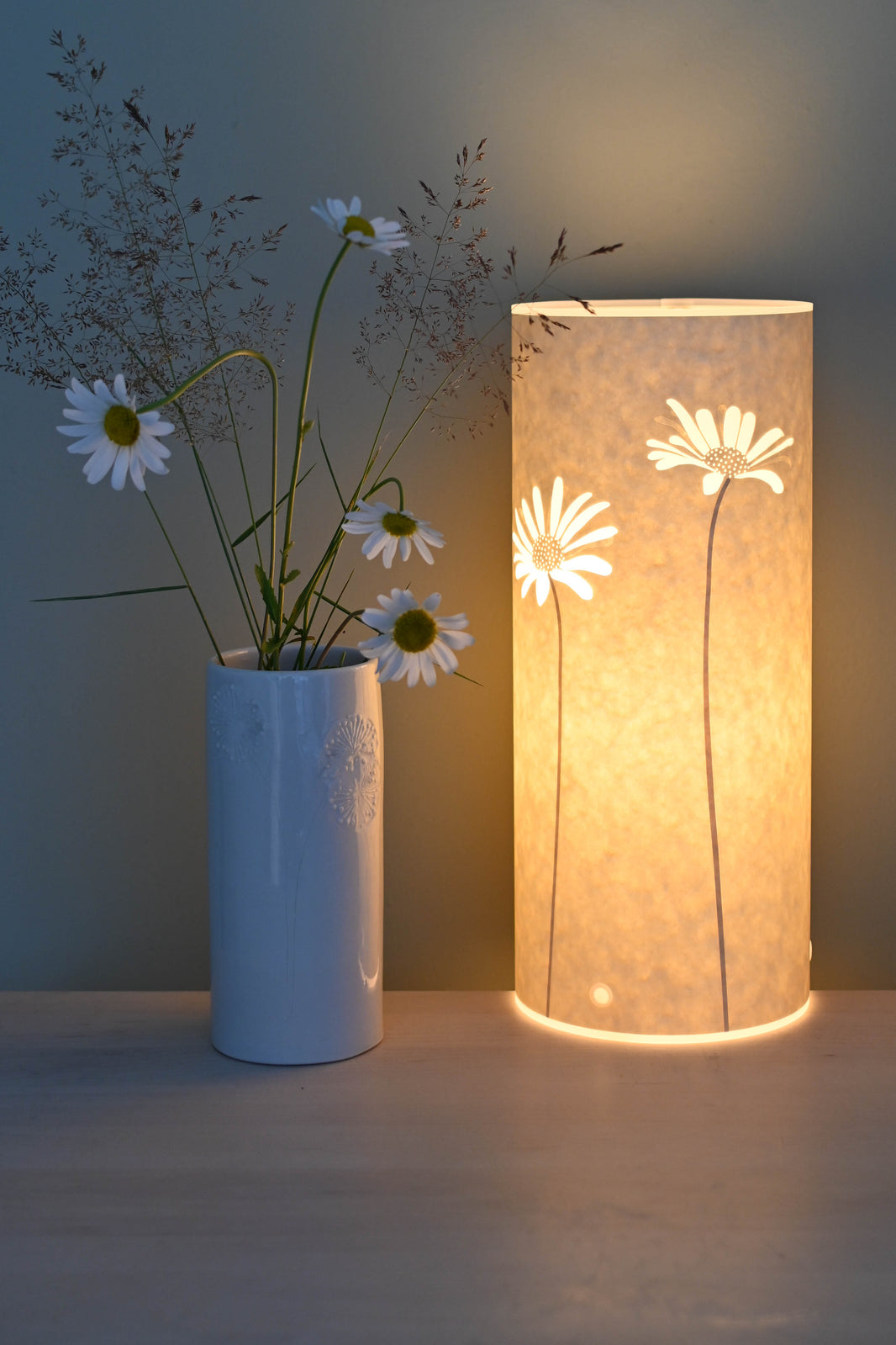 Glowing handmade parchment paper lamps with cut out nature designs by ...