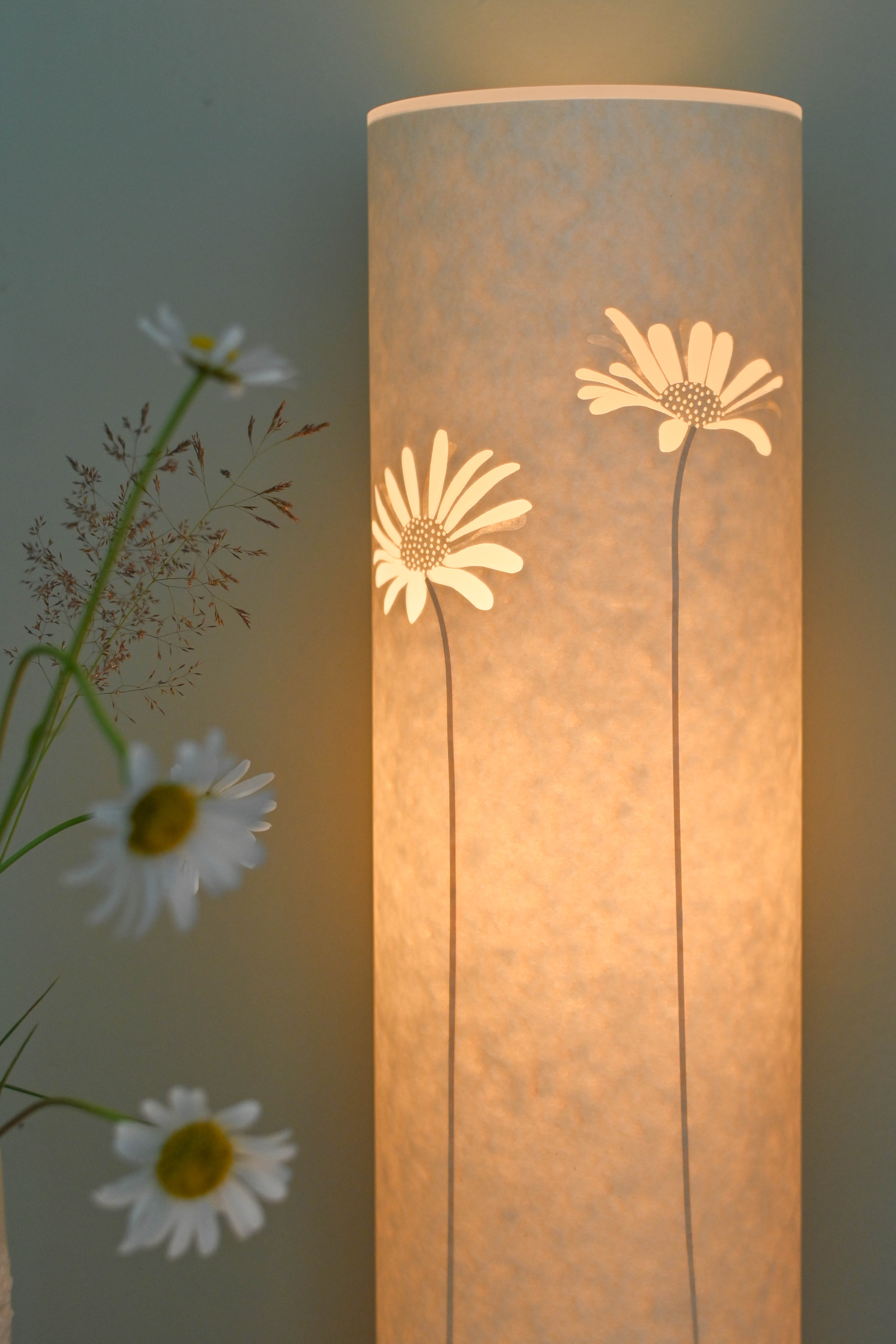 Glowing handmade parchment paper lamps with cut out nature designs by ...