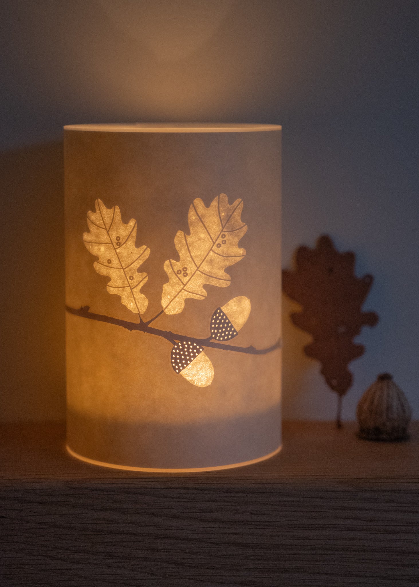 glowing parchment paper candle shades with cut out nature designs by ...
