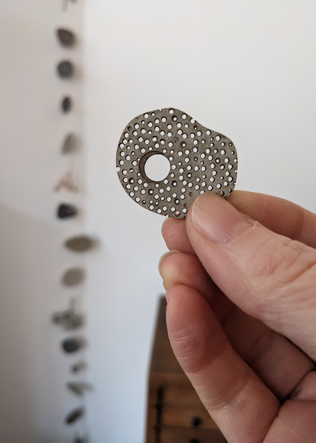 a large collection of paper pebbles & seaweed – Hannah Nunn