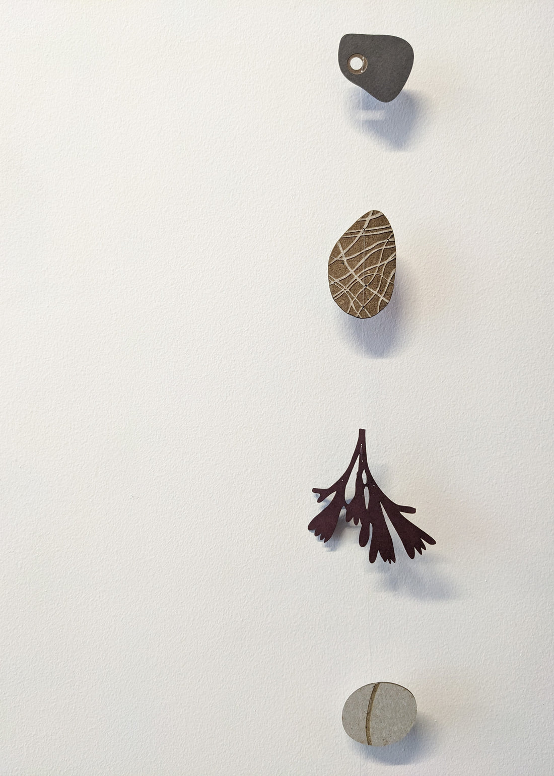 a small collection of paper pebbles & seaweed – Hannah Nunn