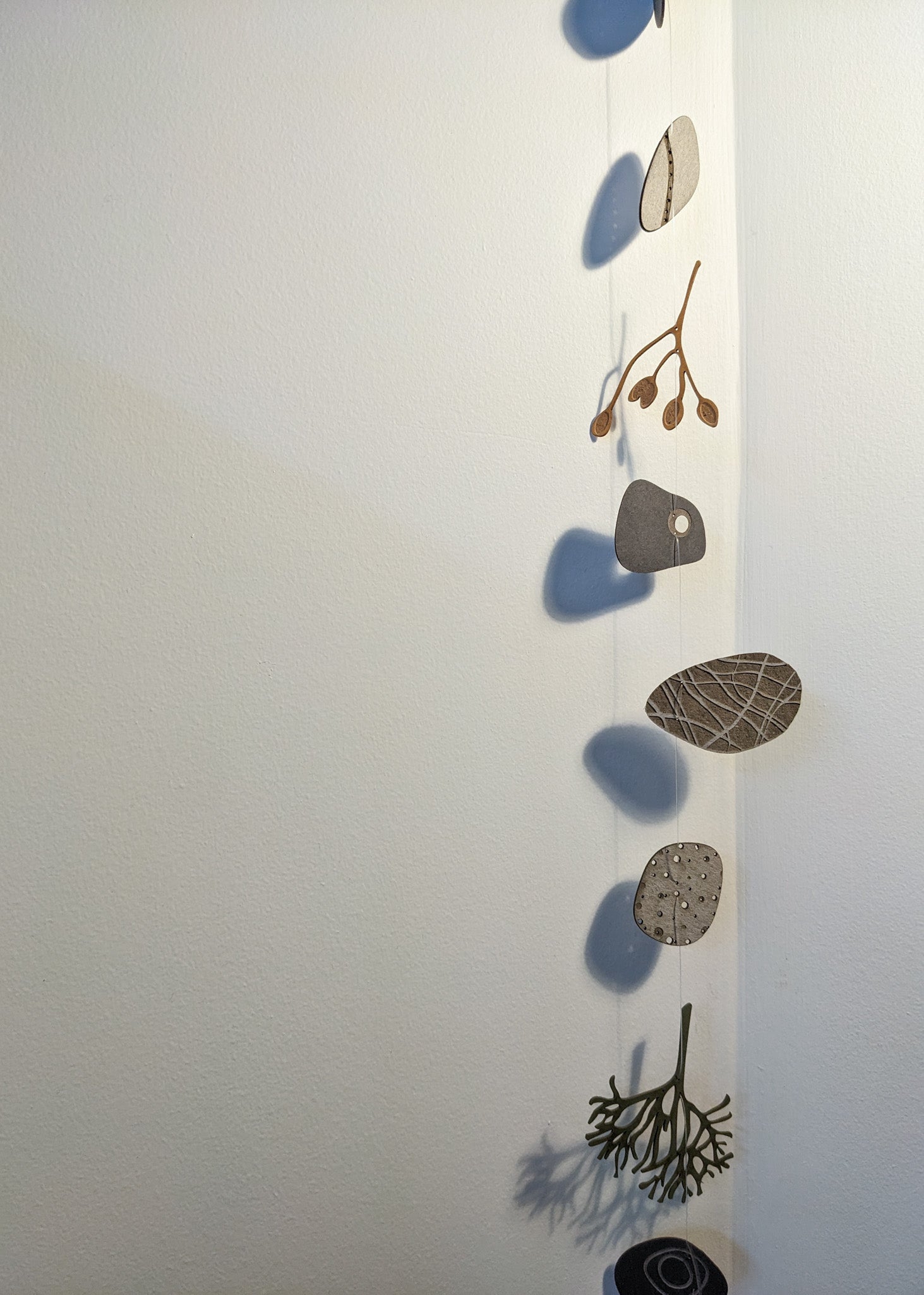 a large collection of paper pebbles & seaweed – Hannah Nunn