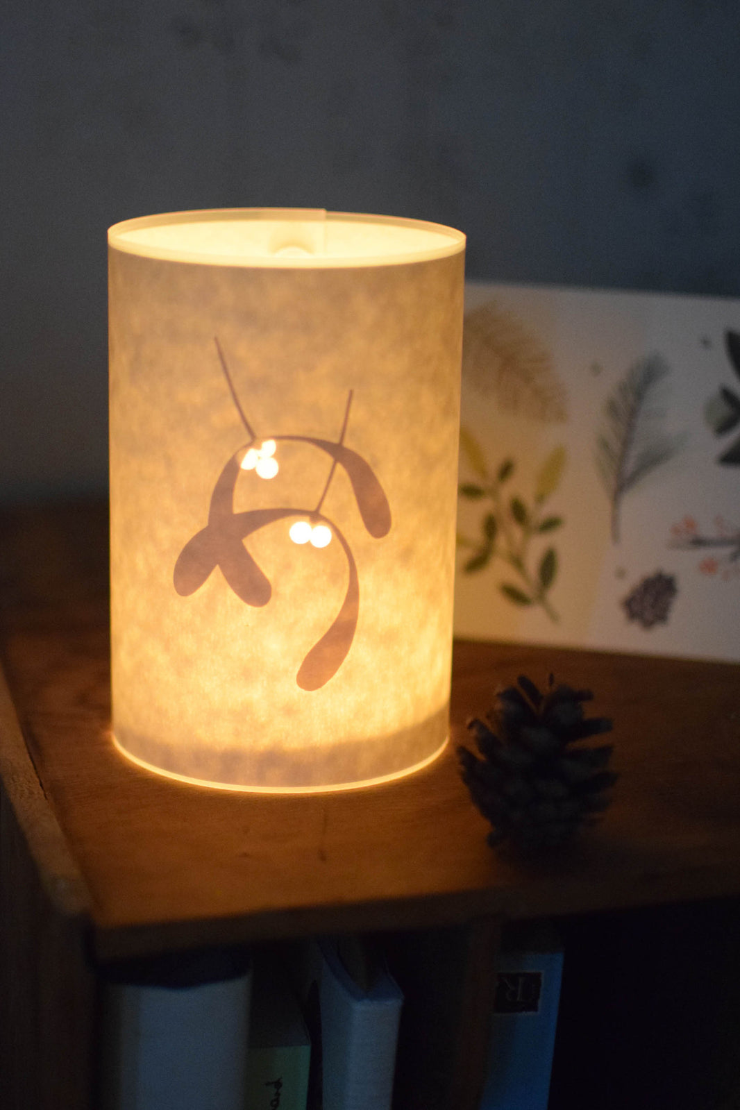 glowing parchment paper candle shades with cut out nature designs by ...