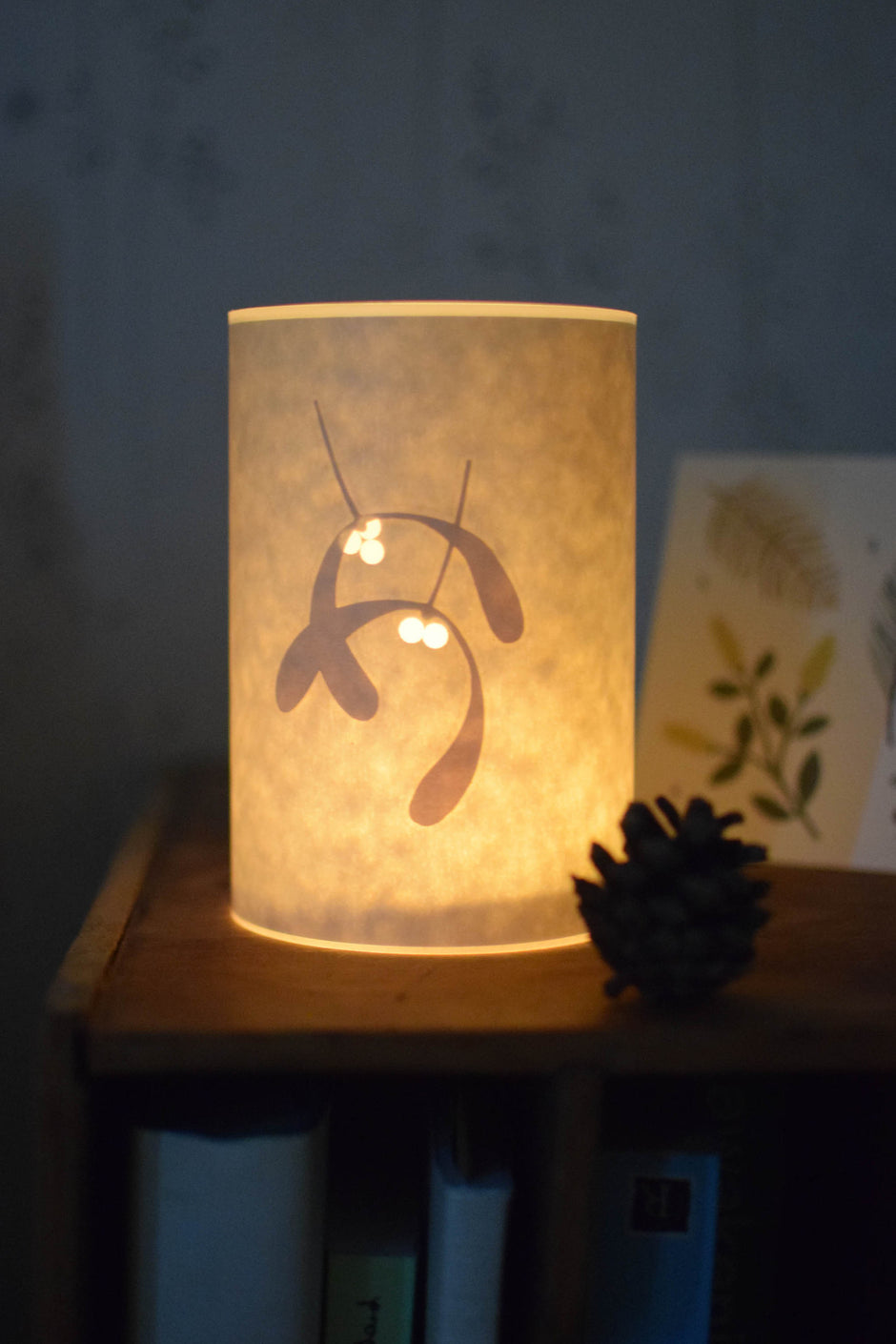 glowing parchment paper candle shades with cut out nature designs by ...