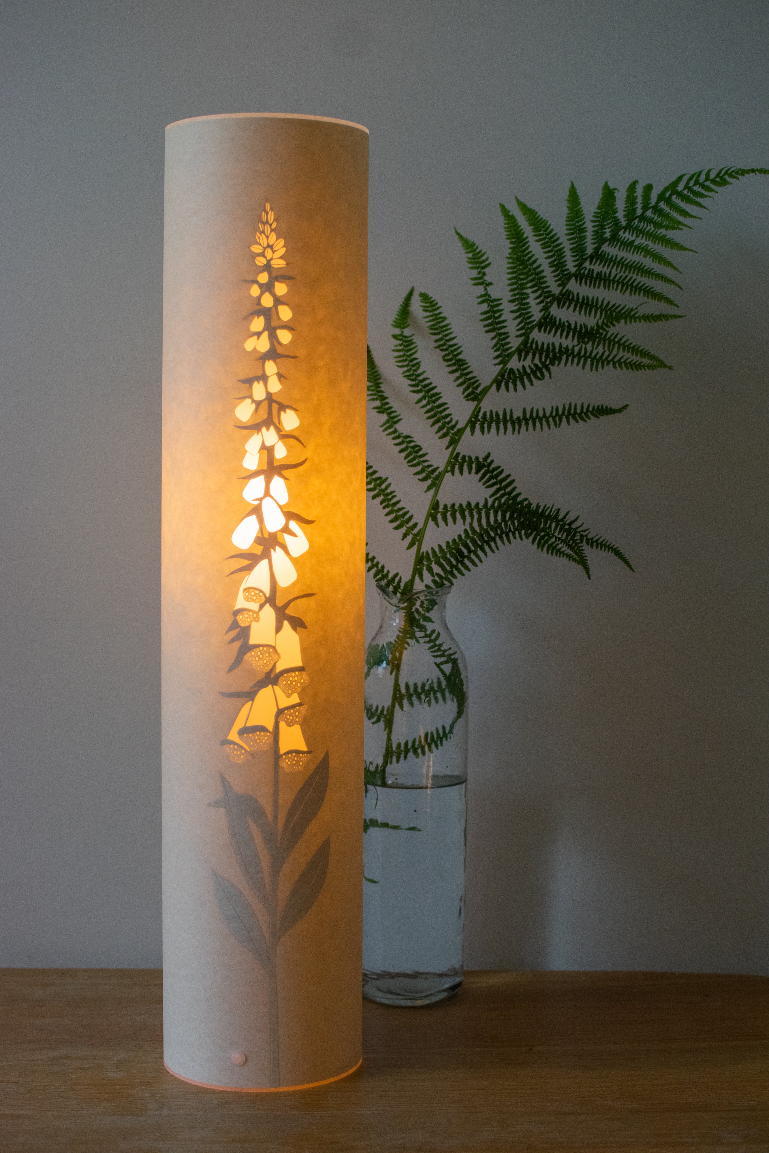Glowing handmade parchment paper lamps with cut out nature designs by ...