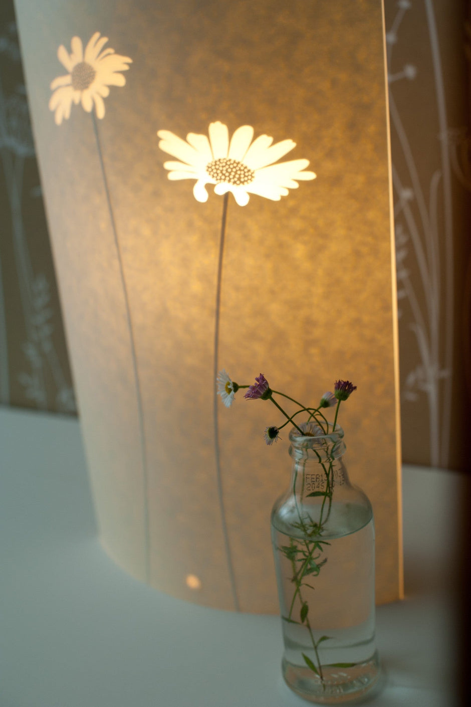 Glowing handmade parchment paper lamps with cut out nature designs by ...