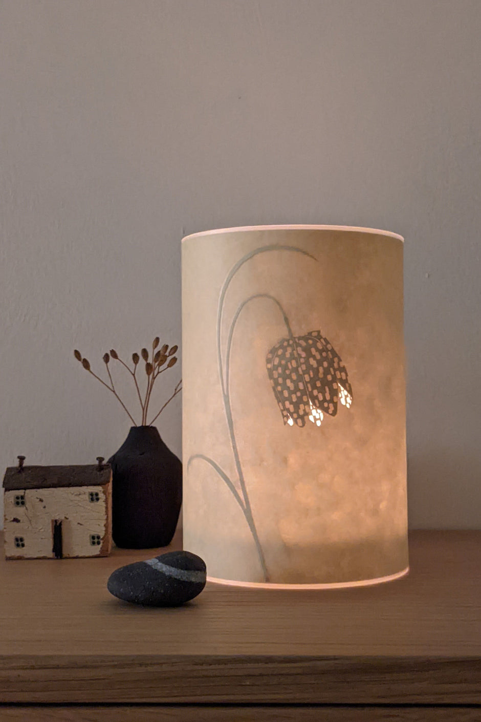 glowing parchment paper candle shades with cut out nature designs by ...