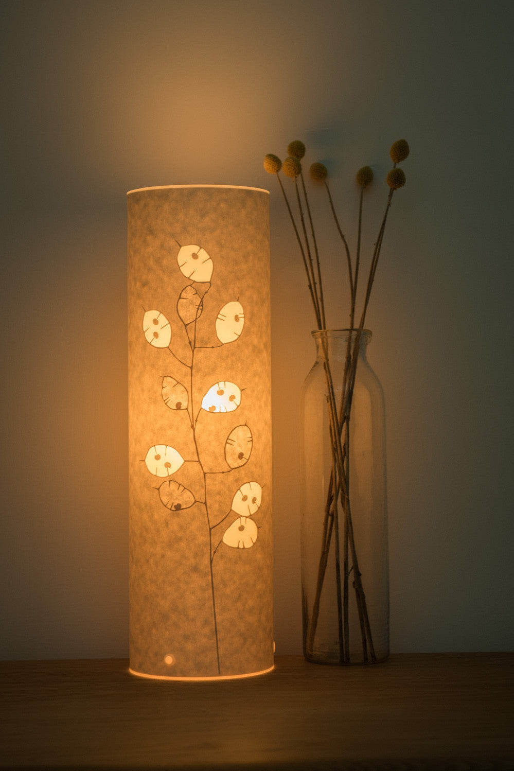 Glowing handmade parchment paper lamps with cut out nature designs by ...