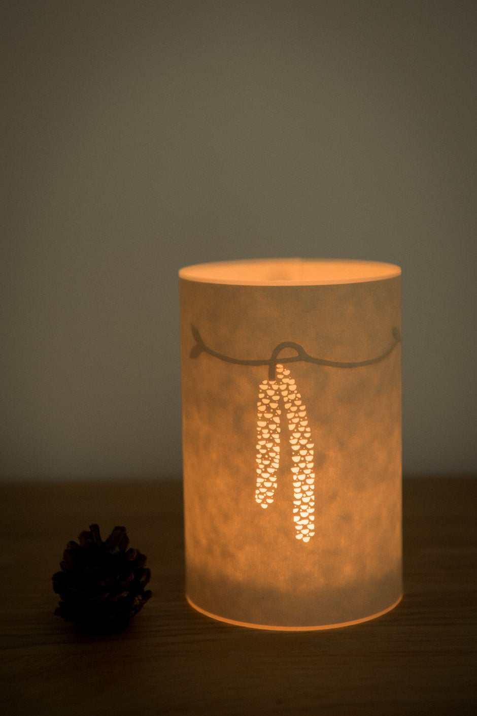 glowing parchment paper candle shades with cut out nature designs by ...