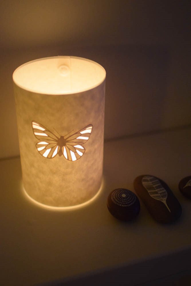 glowing parchment paper candle shades with cut out nature designs by ...