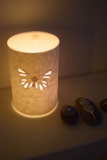glowing parchment paper candle shades with cut out nature designs by ...