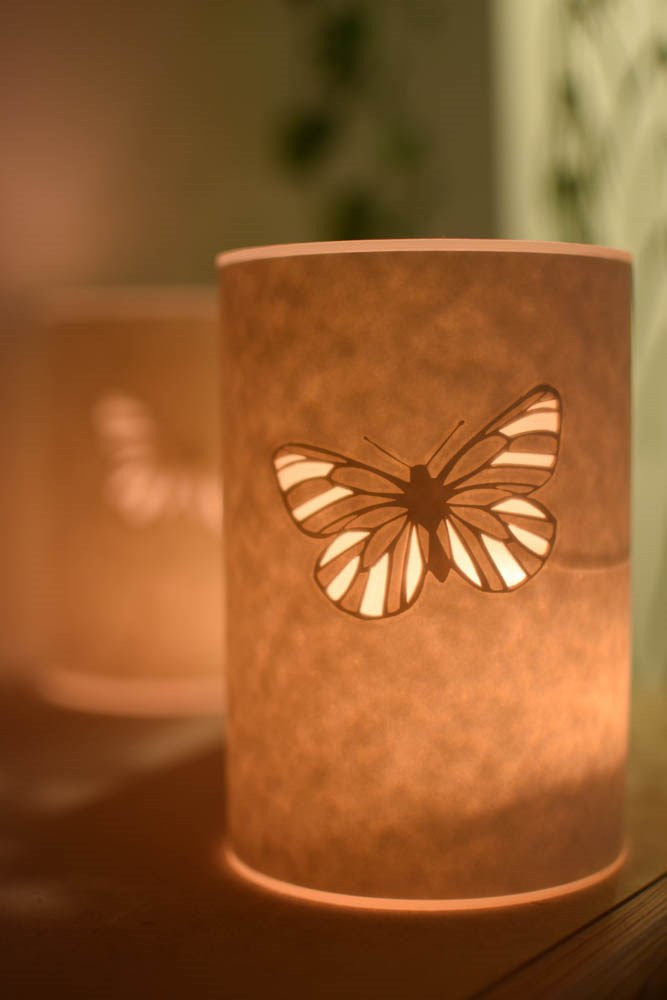 glowing parchment paper candle shades with cut out nature designs by ...