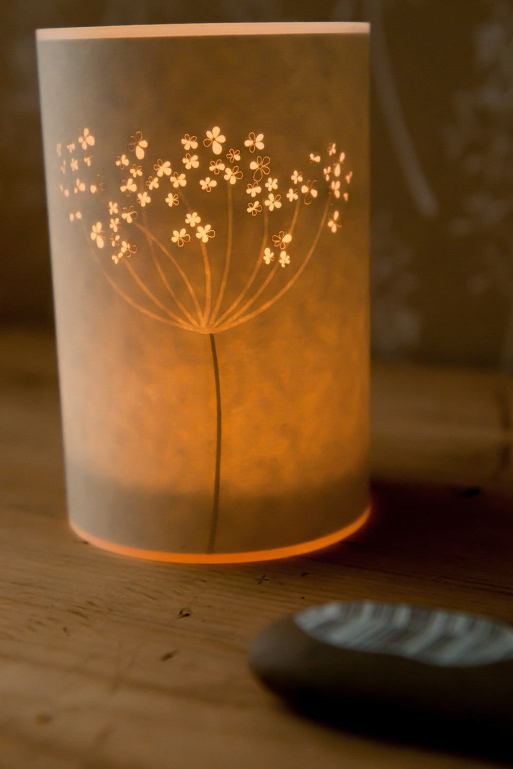 glowing parchment paper candle shades with cut out nature designs by ...