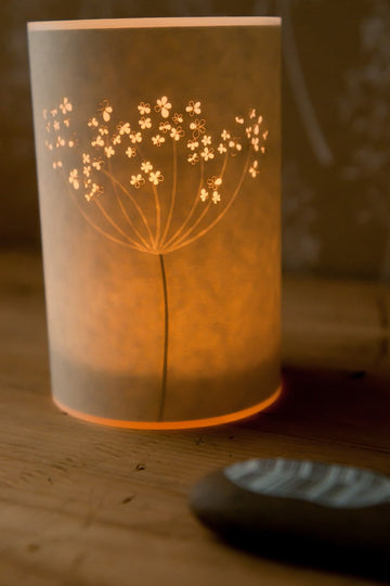 glowing parchment paper candle shades with cut out nature designs by ...