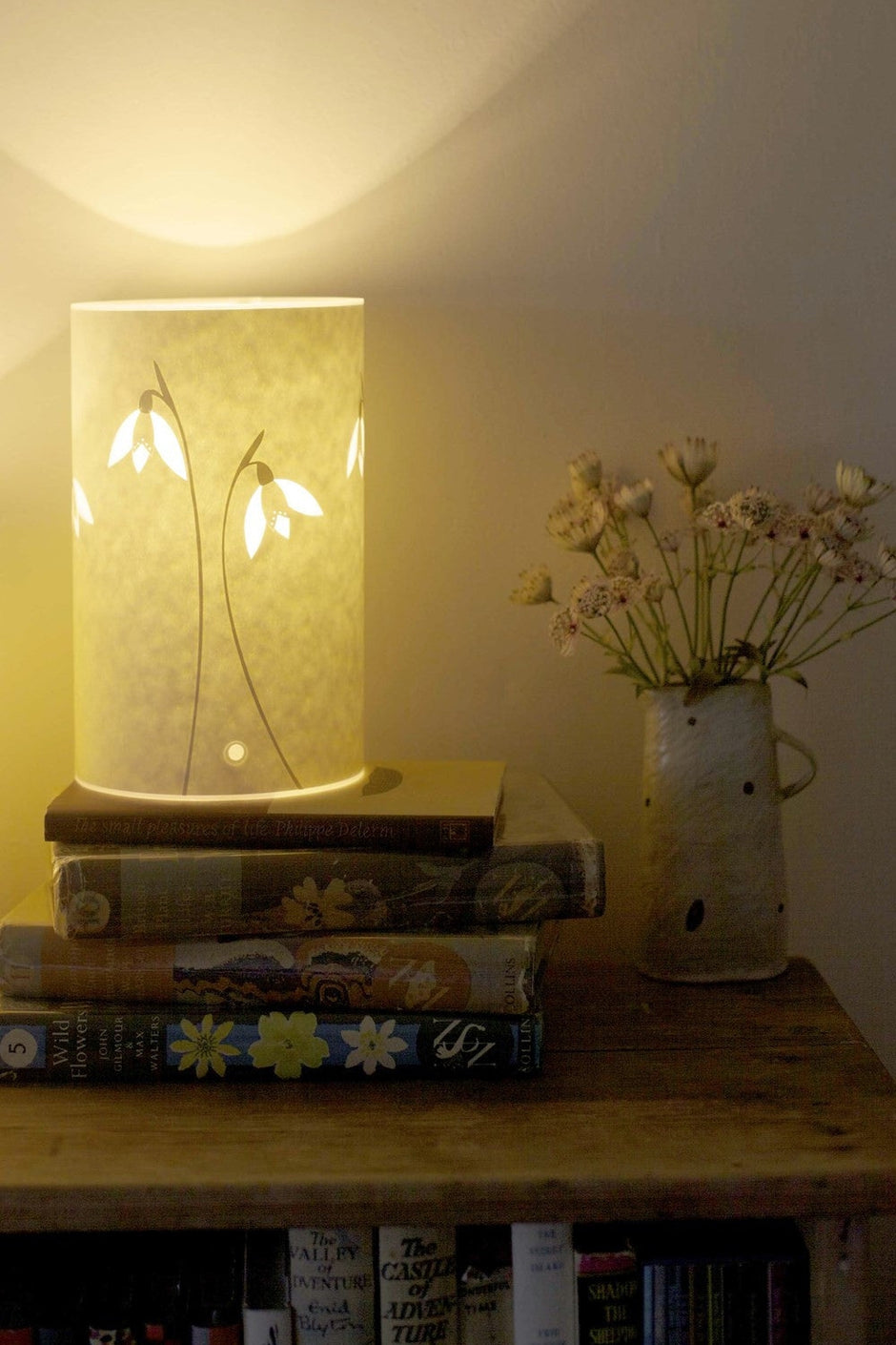 Glowing handmade parchment paper lamps with cut out nature designs by ...